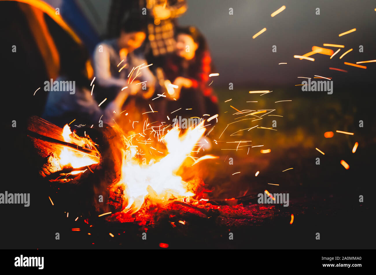 Summer night family campfire near tent hi-res stock photography and ...