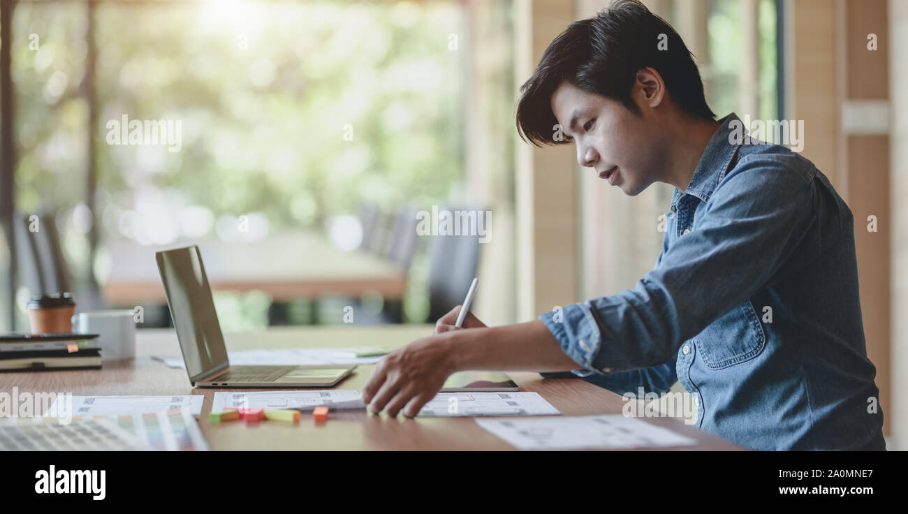 Professional male UI web developer working on his project about UX ...