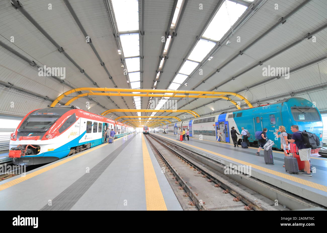 People travel at Leonardo da Vinci Fiumicino airport train station Rome ...