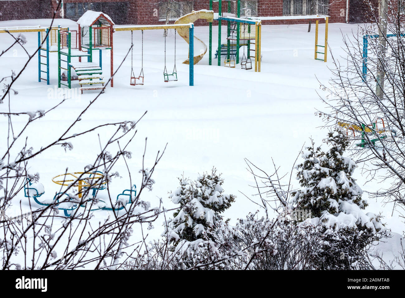 Children's playground in winter all in the snow Stock Photo - Alamy