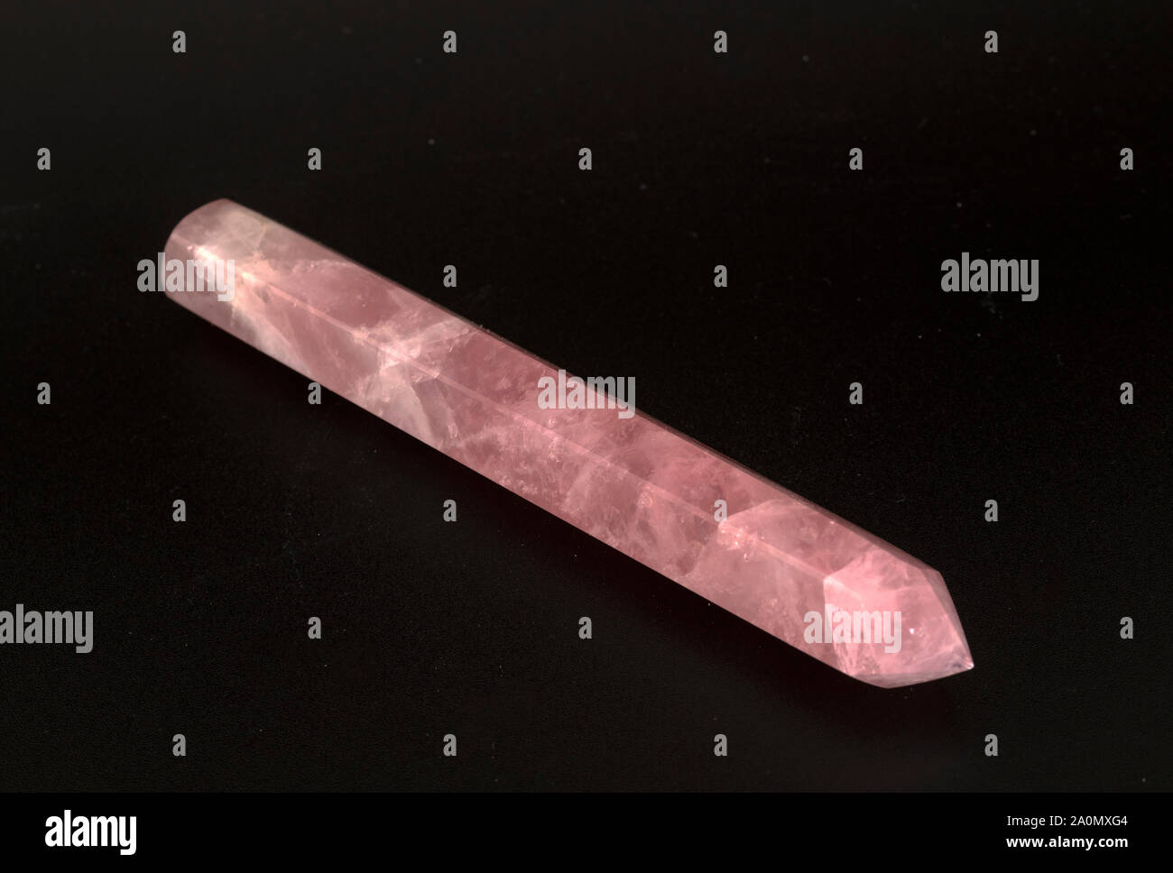 pink quartz in front of white background Stock Photo - Alamy