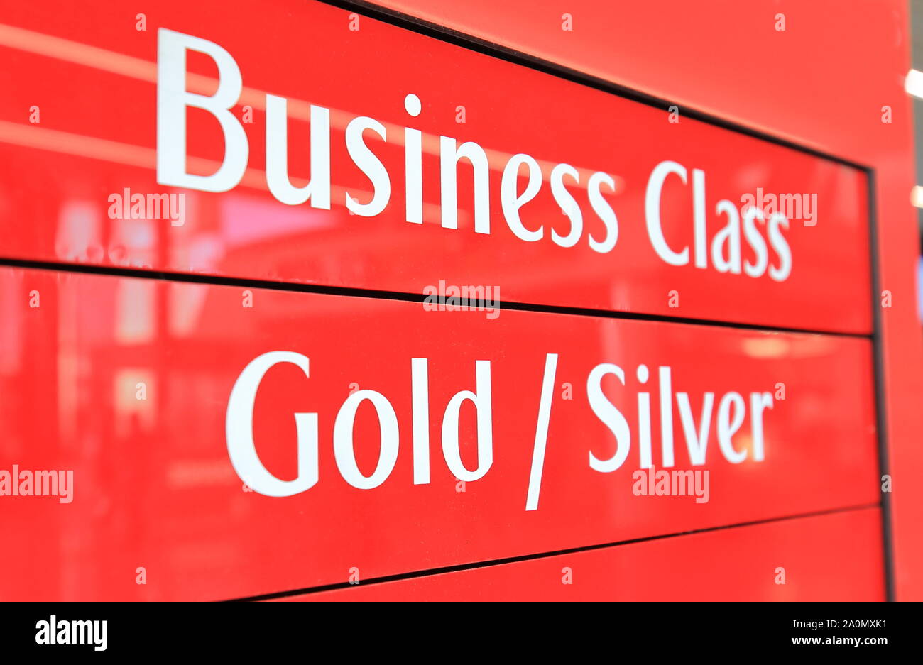 Business class sign check in airport Stock Photo - Alamy