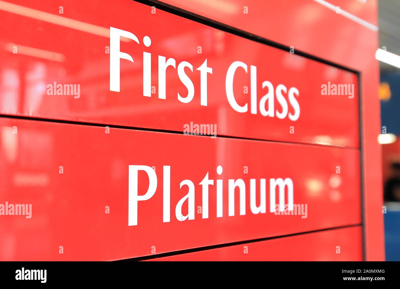 First class sign check in airport Stock Photo - Alamy