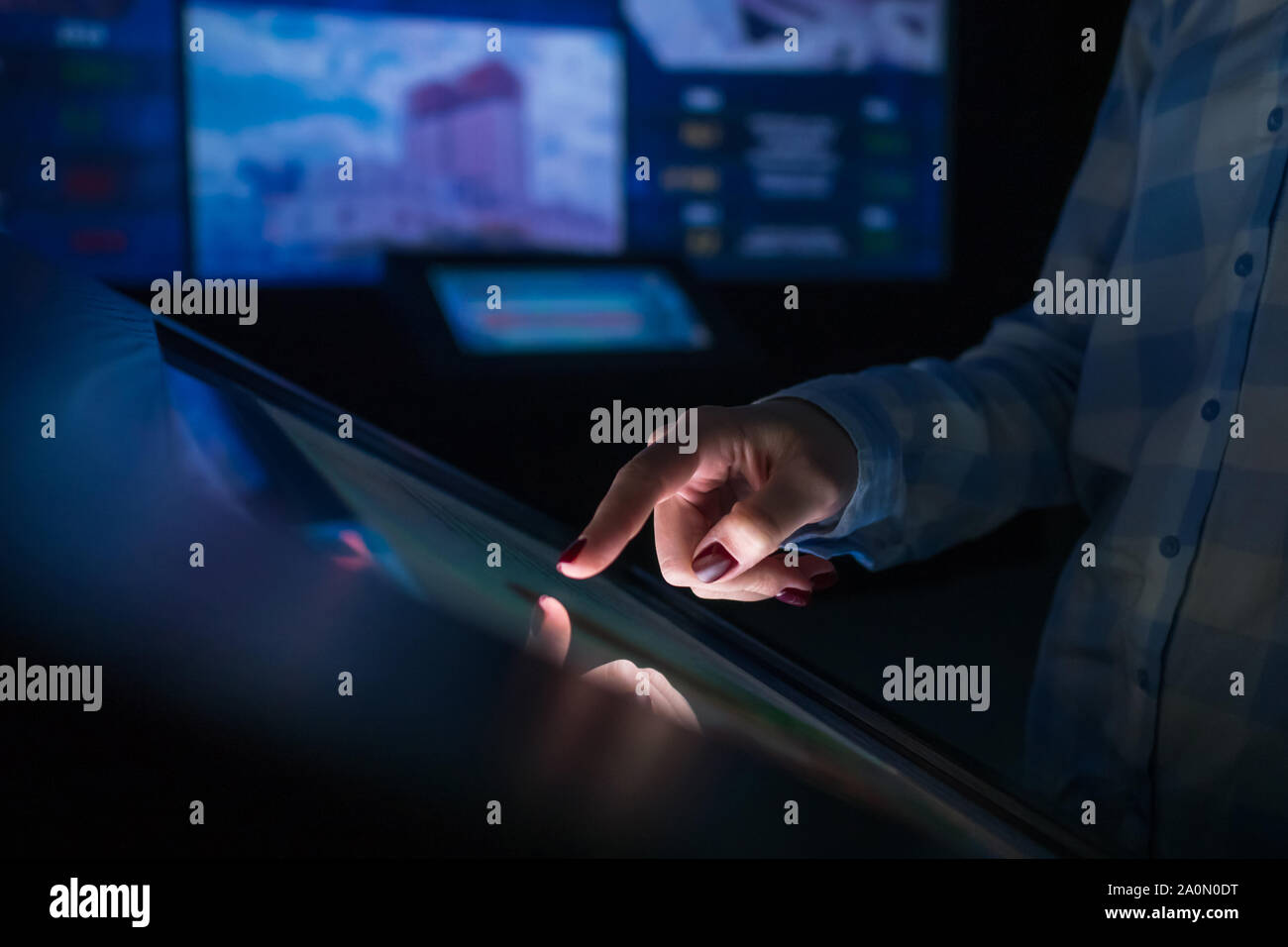 Woman using multimedia touchscreen display of interactive kiosk Stock ...