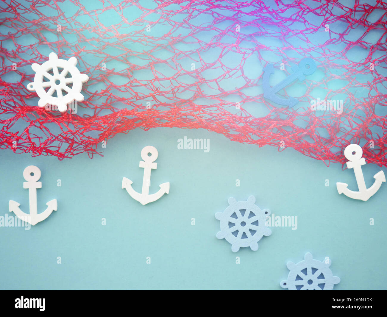 decorative blue background with fishing net, anchors and steering ...