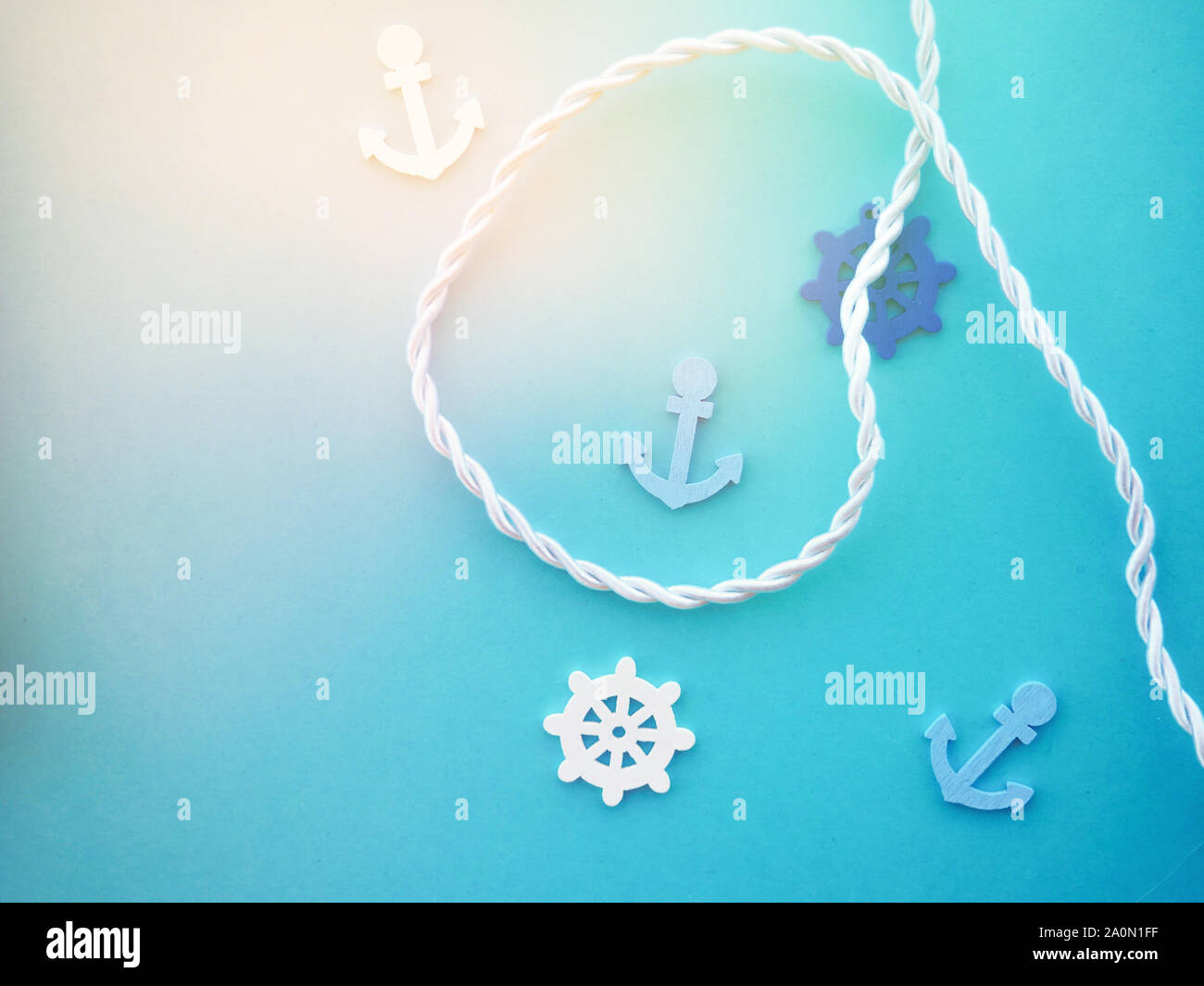 decorative blue background with fishing net, anchors and steering ...
