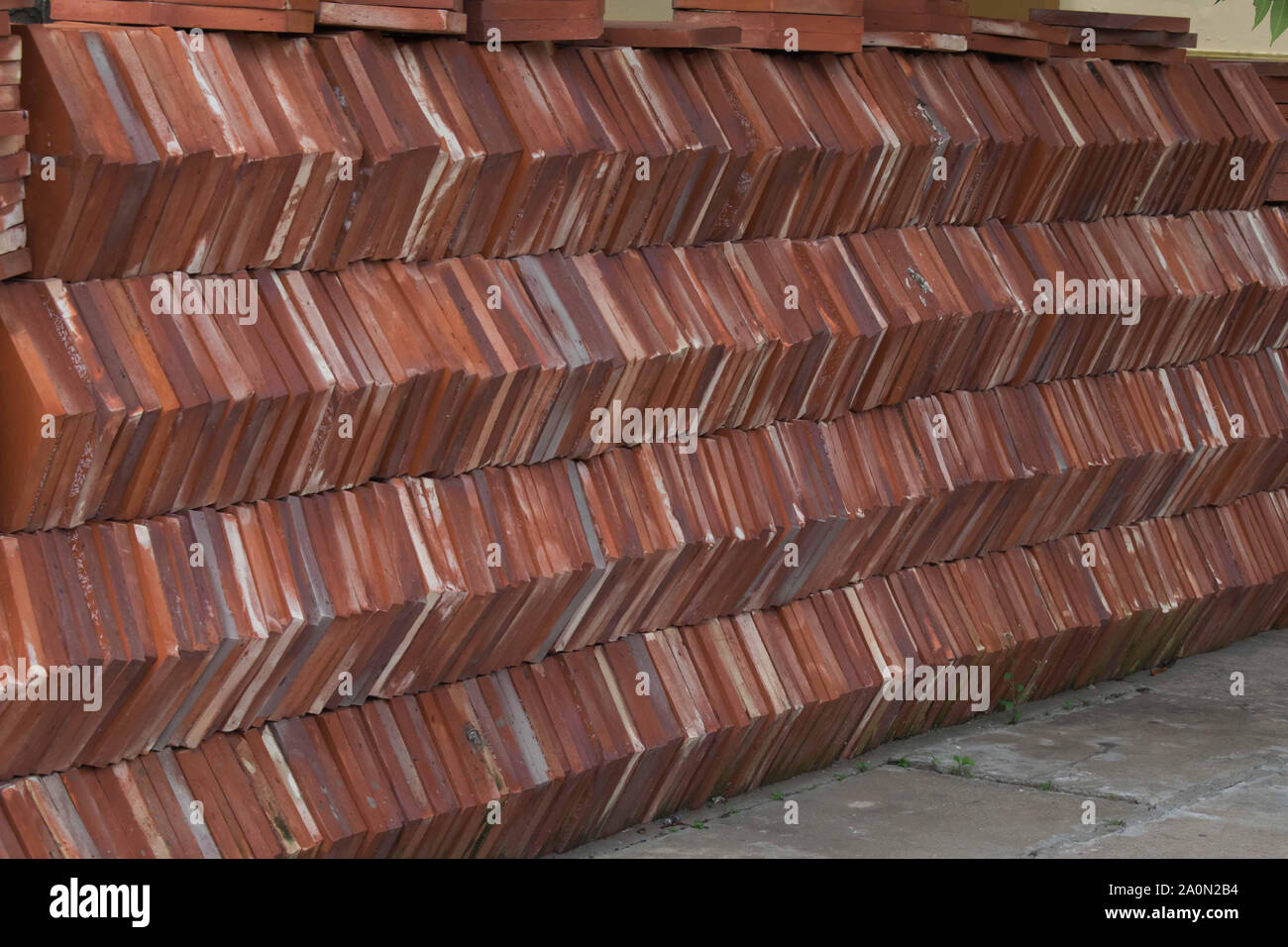 Brown burnt clay tiles arranged and piled neatly Stock Photo - Alamy