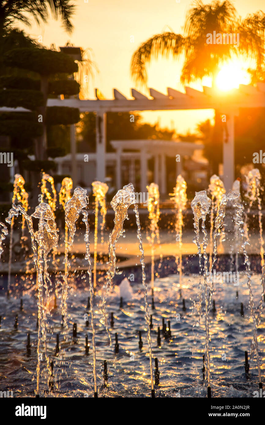 Beautiful fountain in the resort town in the sunset light. Modern ...