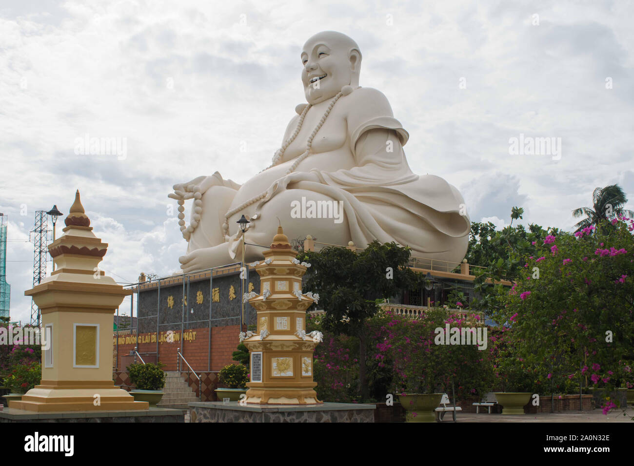 Vinh Trang Pagoda. Smiling Buddha statue in Vinh Trang Pagoda. My Tho ...