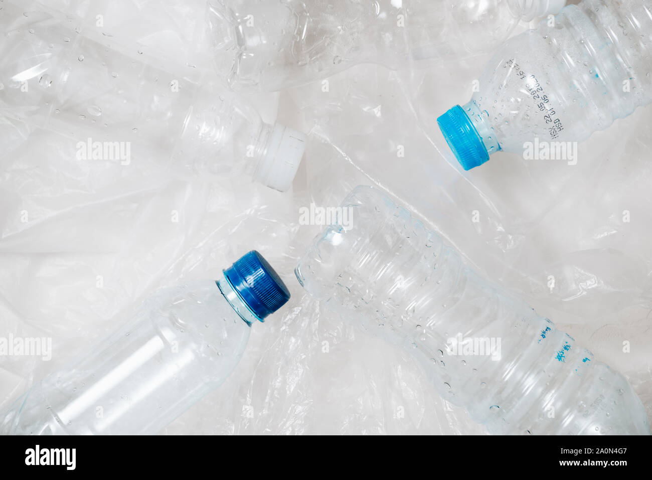 plastic bottles stack to recycle on white background Stock Photo - Alamy