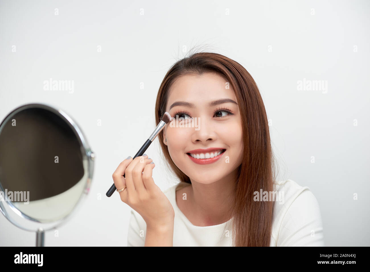 Close up of beautiful face of asian young woman getting make-up. Asian ...