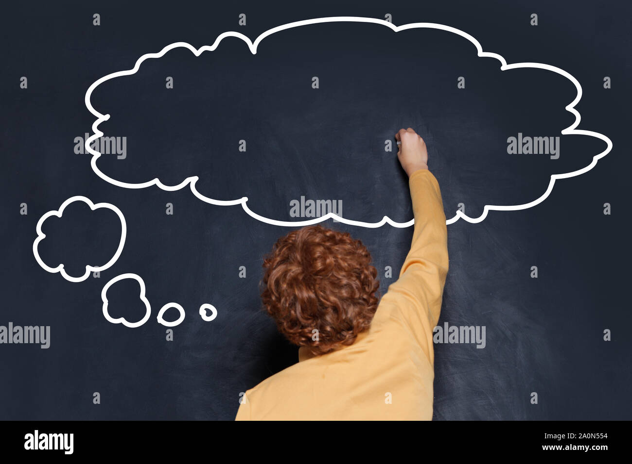 Child drawing empty speech clouds bubbles on chalkboard Stock Photo - Alamy