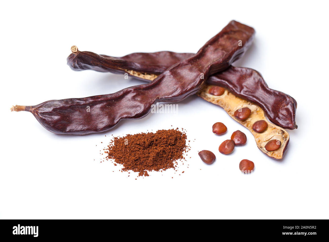 Carob beans. Healthy organic sweet carob pods on white background Stock ...