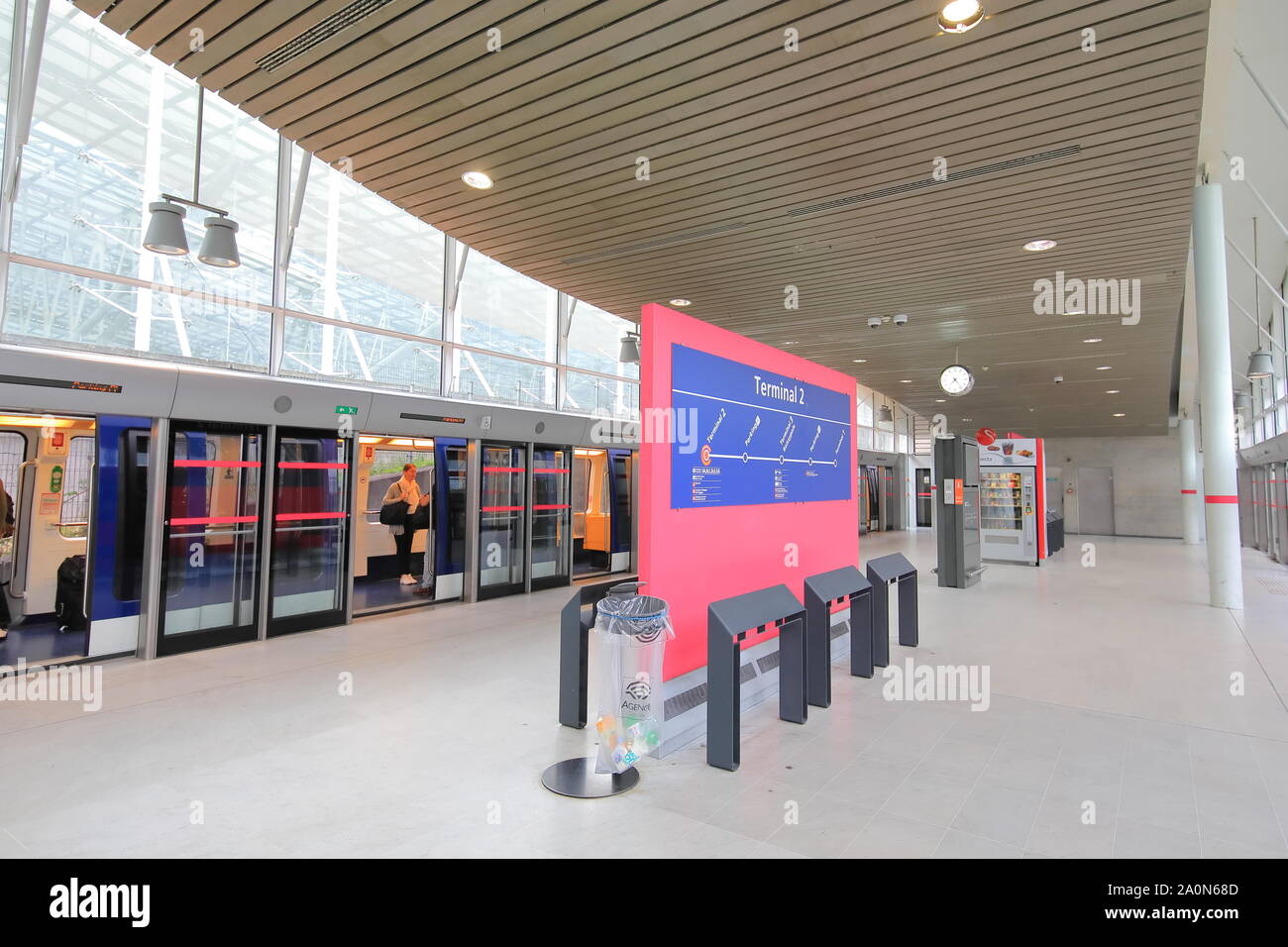 People travel by terminal shuttle train Charles de Gaulle Airport Paris ...