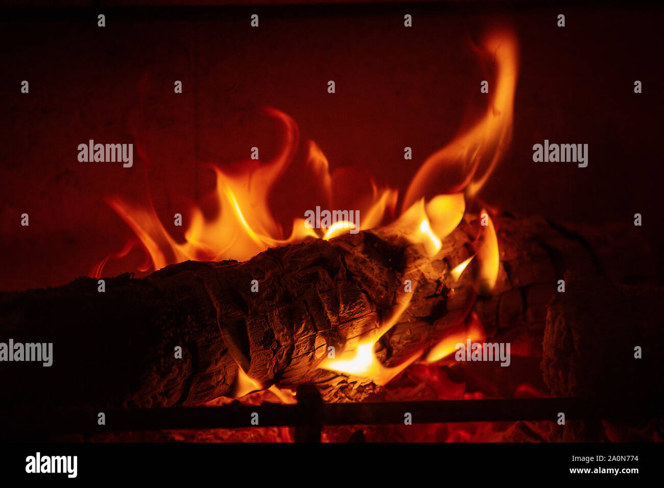 Natural fireplace burning wallpaper Stock Photo - Alamy