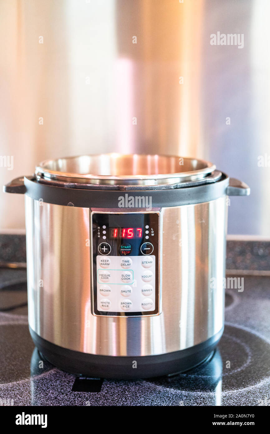 Cooking dinner in a pressure cooker in a modern kitchen Stock Photo - Alamy