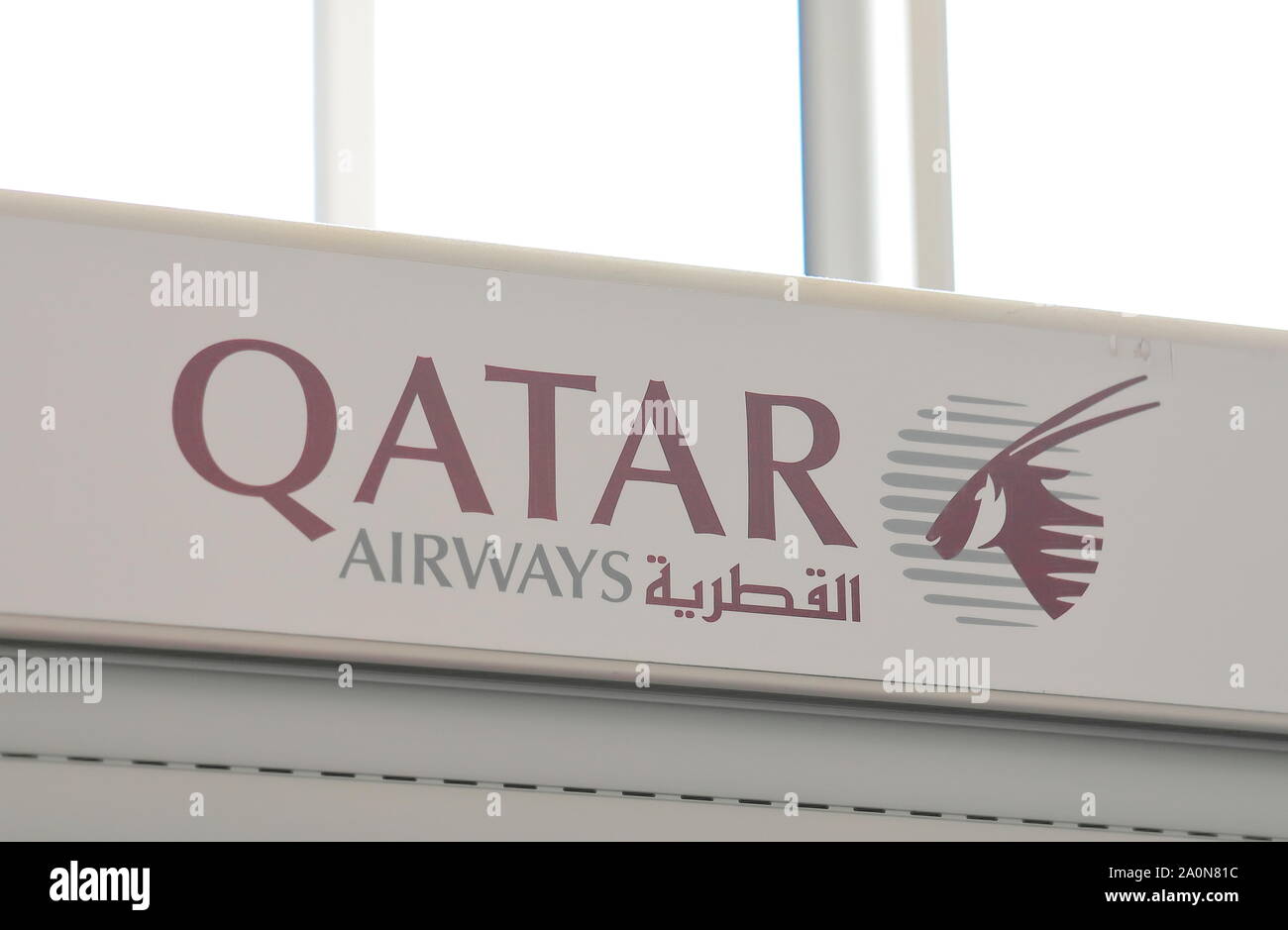 Qatar airline company sign Stock Photo - Alamy