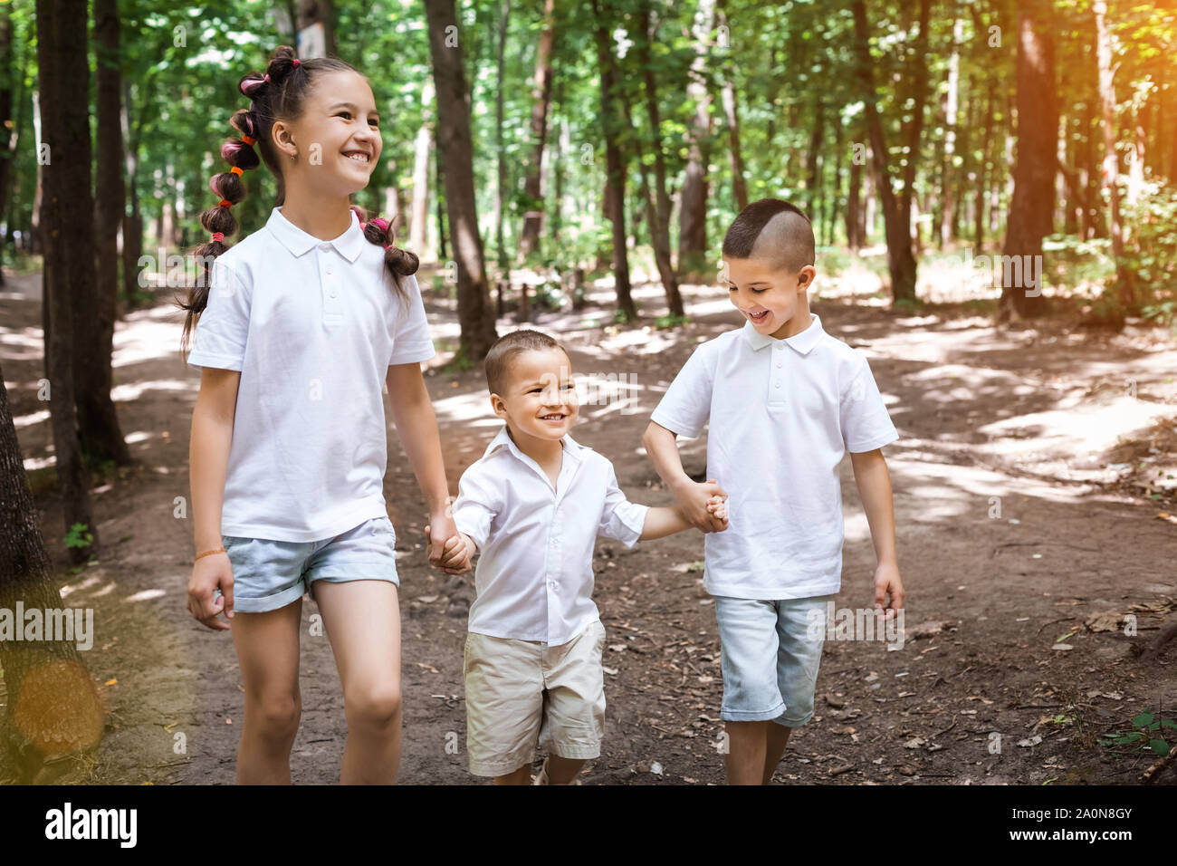 happy kids walking in the forest Stock Photo - Alamy