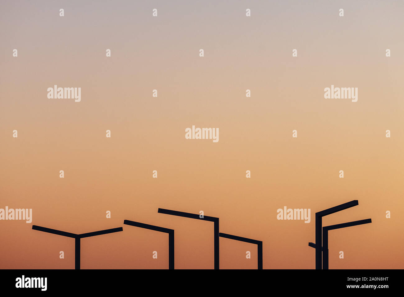 Light Poles silhouette in sunset Stock Photo - Alamy