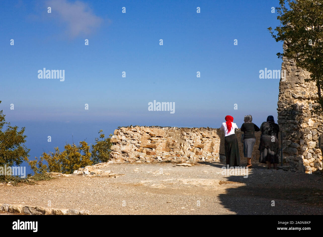 Three Turkish ladies look out from the ruins of the Byzantine/Lusignan ...