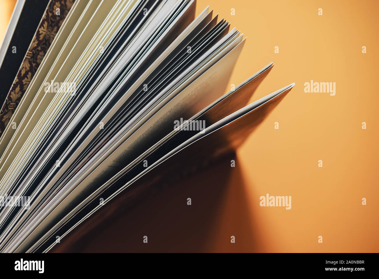 Close up Beautiful new book on a orange background. Top view Stock ...