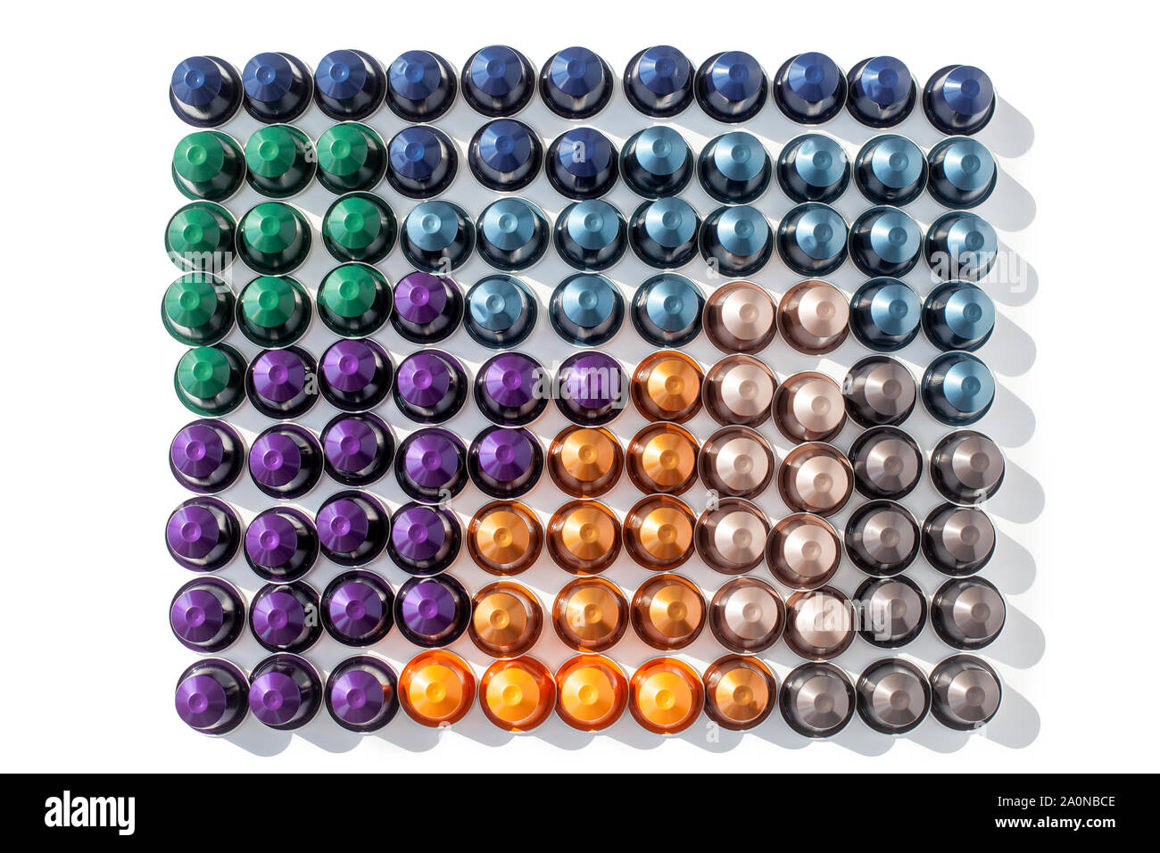 Coffee capsules different kinds and colors on a white background top ...