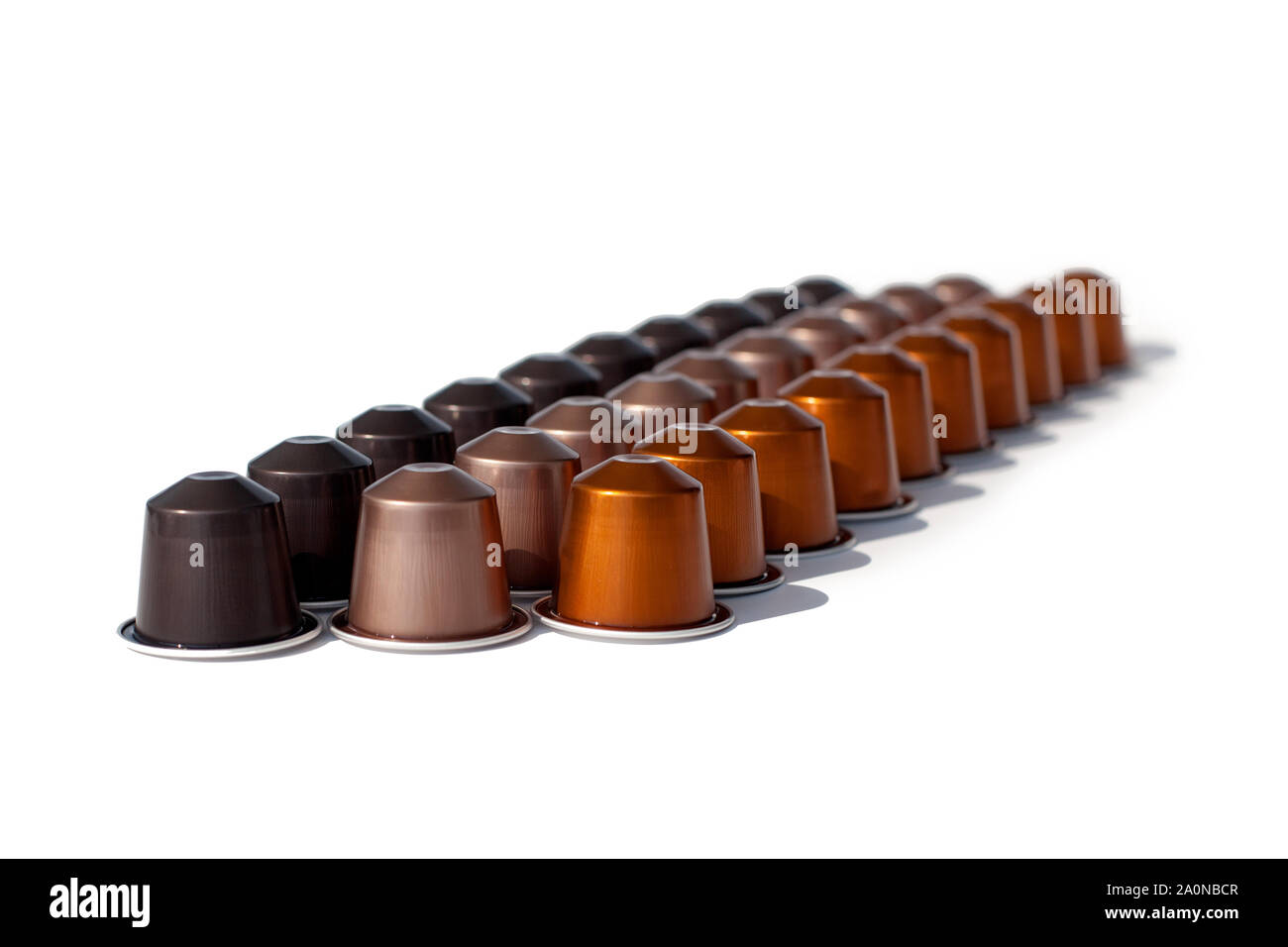 Coffee capsules different kinds and colors on a white background ...
