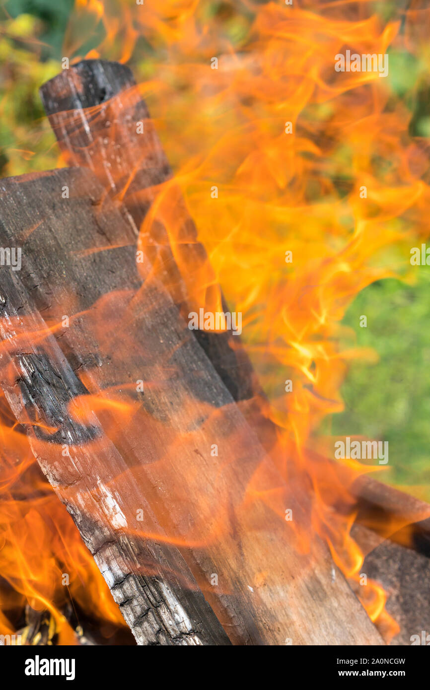 Fireplace burning. Warm cozy burning fire in a brick fireplace close up ...