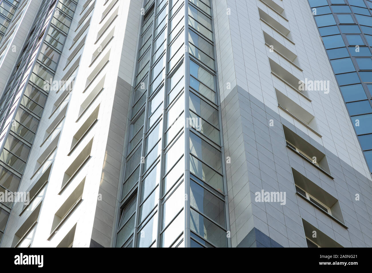 Tiled modern design apartment building, ground view Stock Photo - Alamy