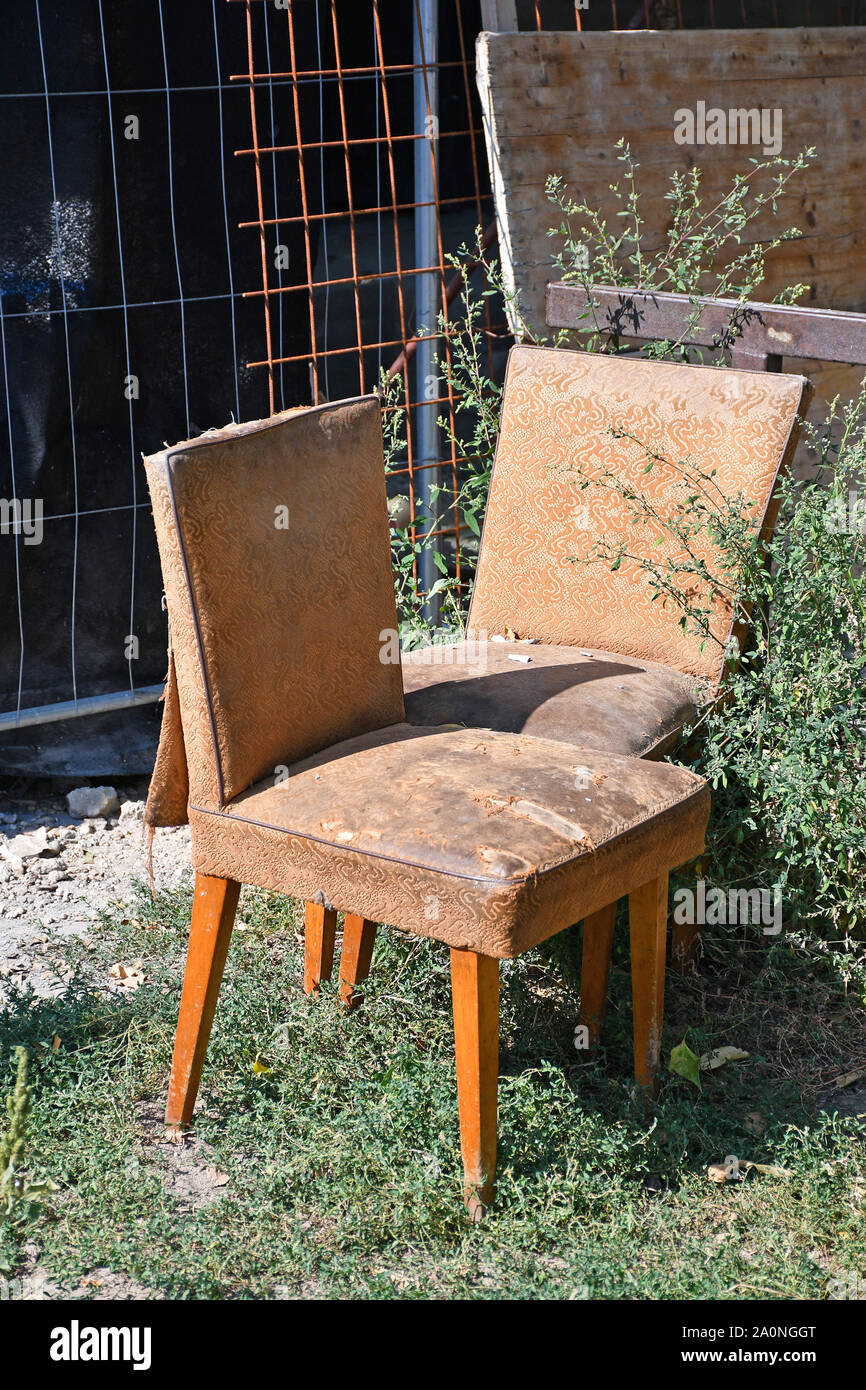 Old ruined chairs outdoors Stock Photo - Alamy