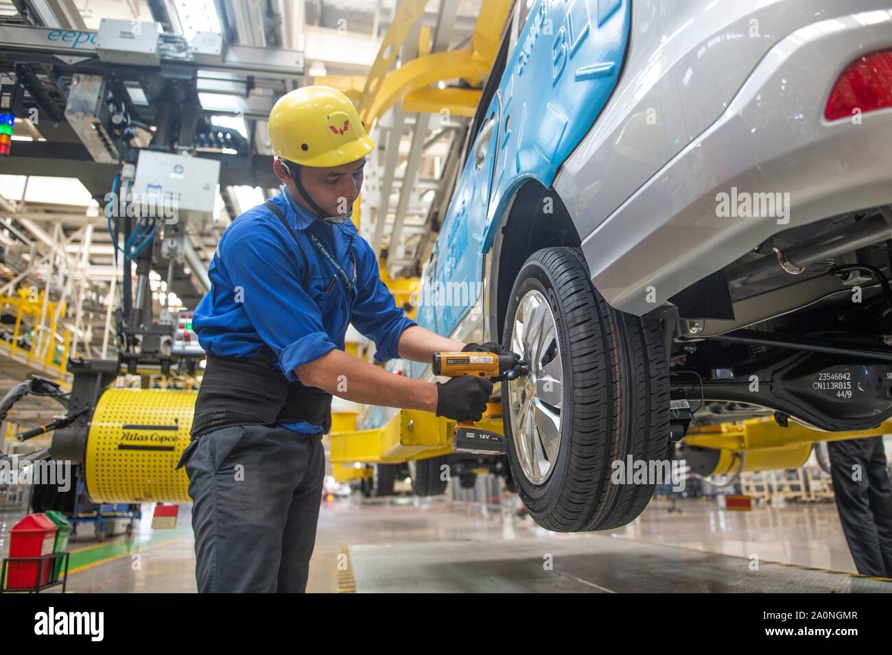 Beijing, Indonesia. 14th Mar, 2019. A worker assembles a vehicle at the ...