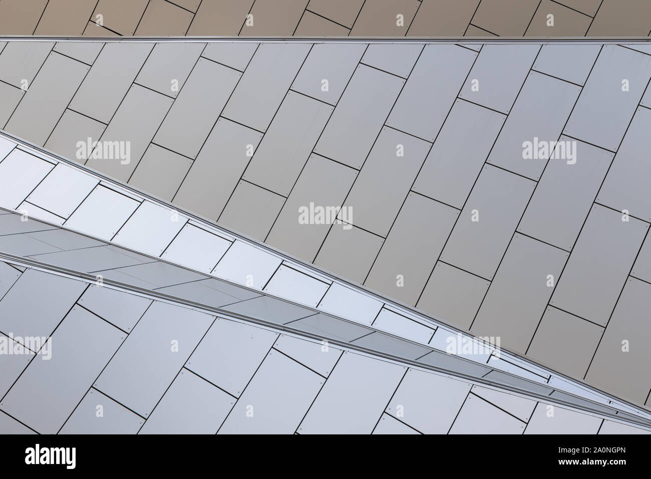 Close-up of geometrically designed building with white tiled walls and ...