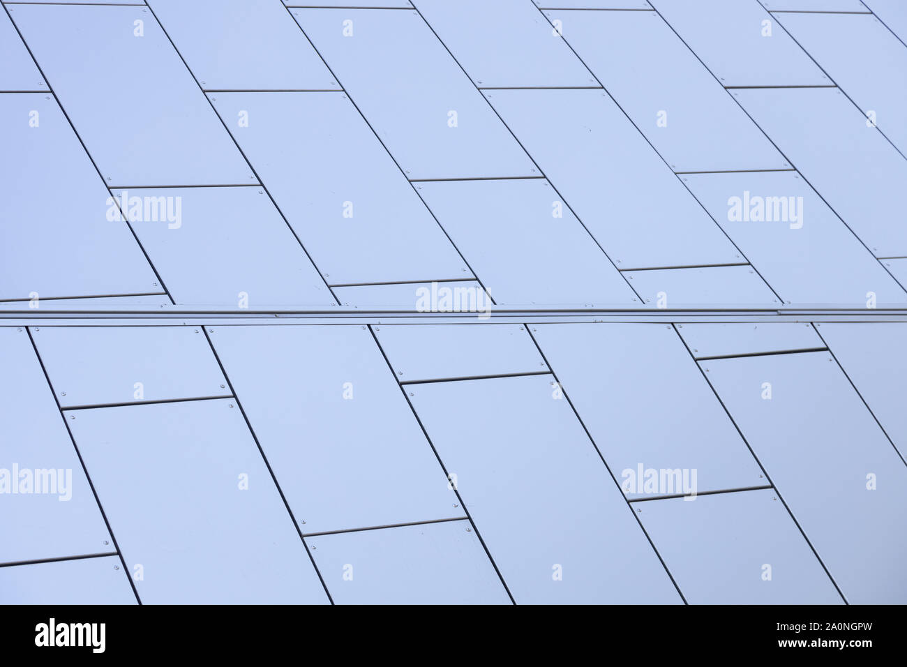 Wide angle view of white smooth wall of geometrically designed building ...