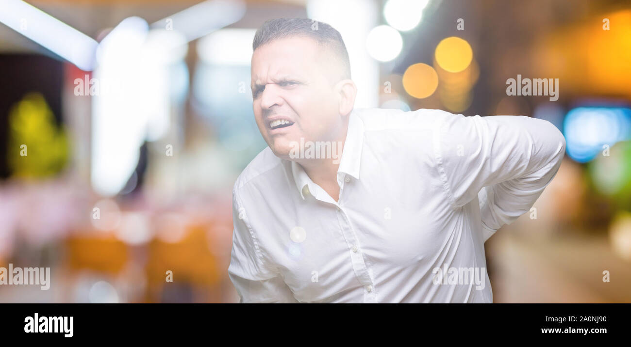 Middle age arab elegant man over isolated background Suffering of ...