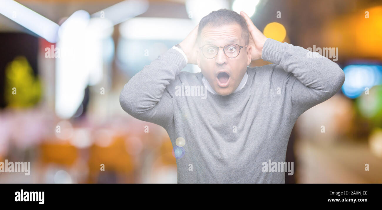 Old man looking shocked hands on head hi-res stock photography and ...