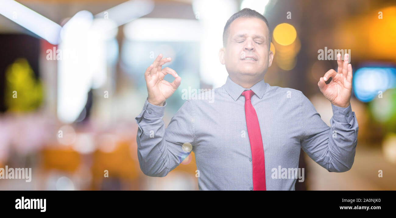 Middle age arab man wearing red tie over isolated background relax and ...