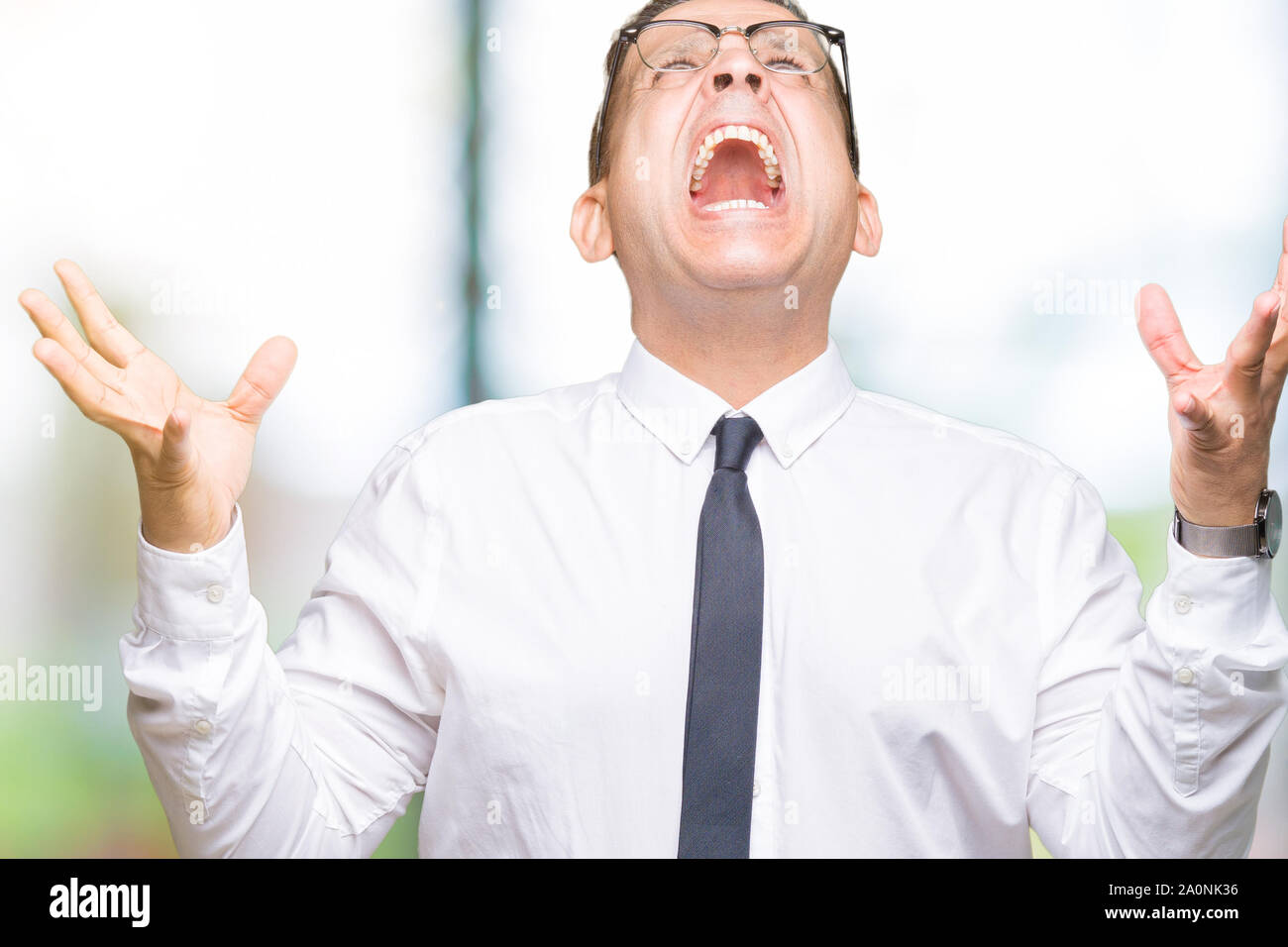 Middle age bussines arab man wearing glasses over isolated background ...