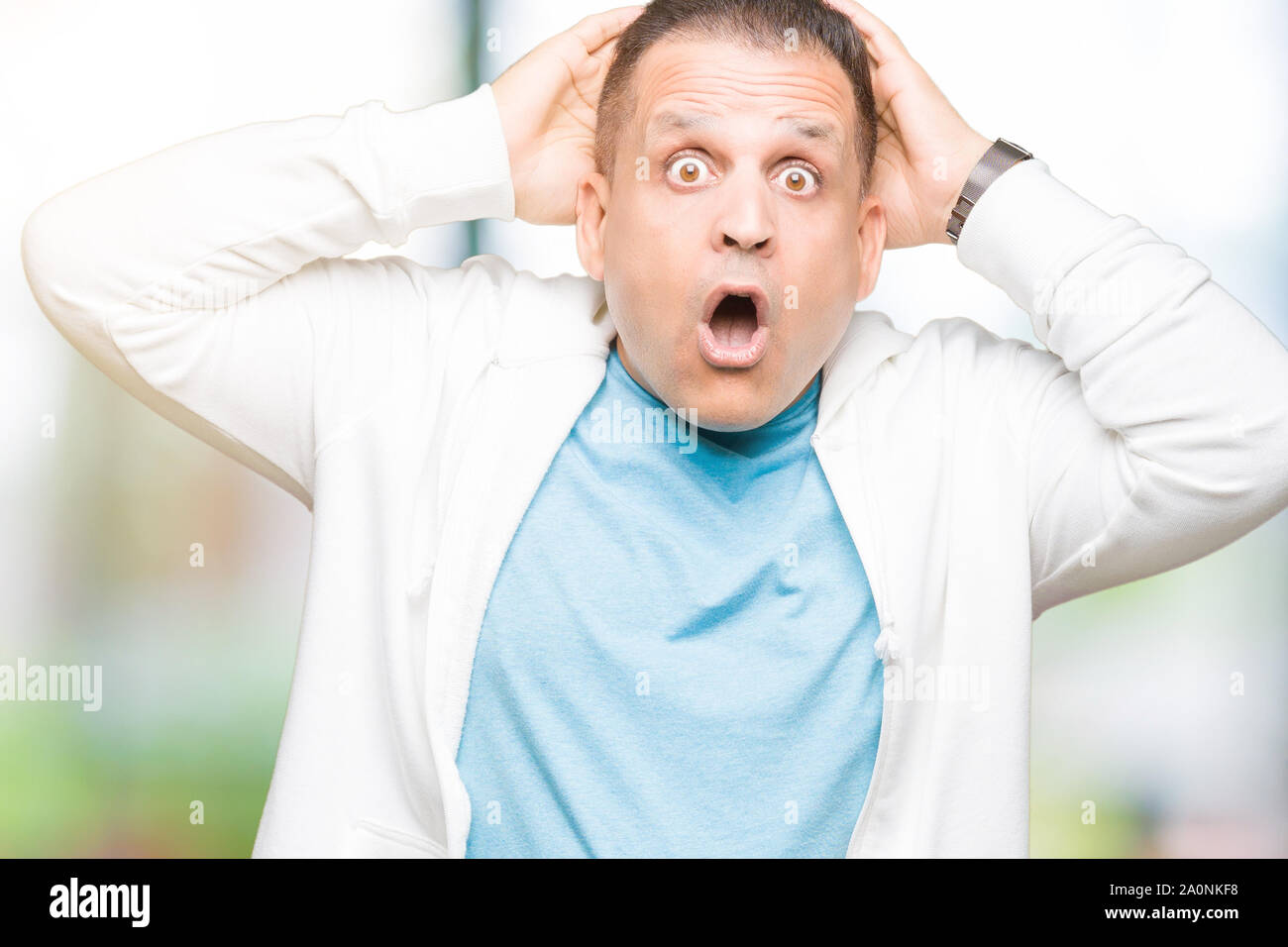 Middle age arab man wearing sweatshirt over isolated background Crazy ...