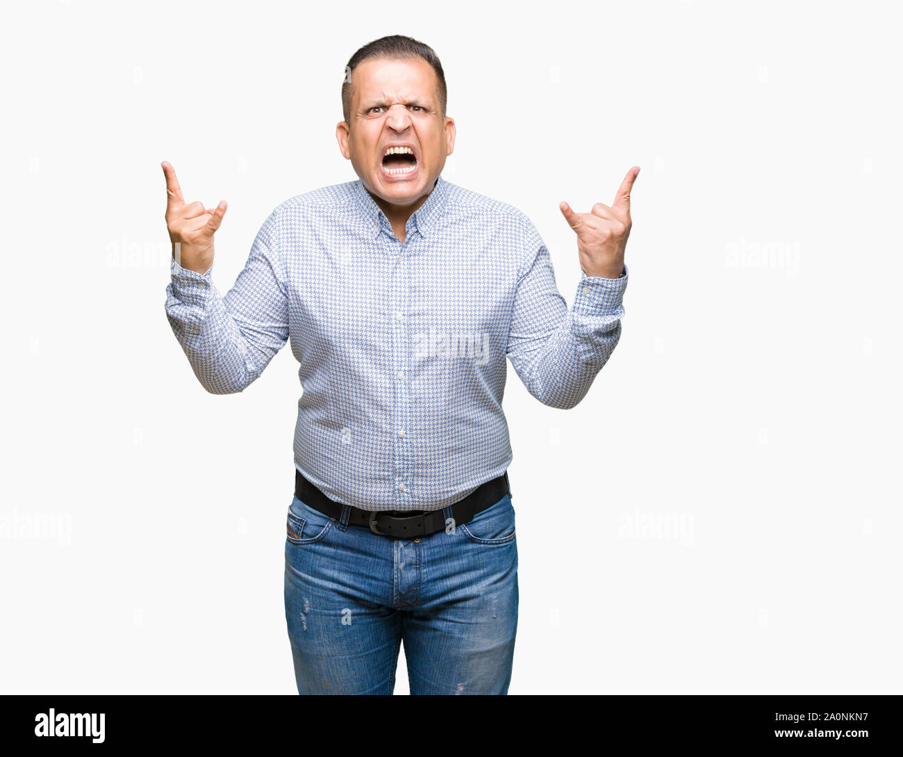 Middle age arab business man over isolated background shouting with ...