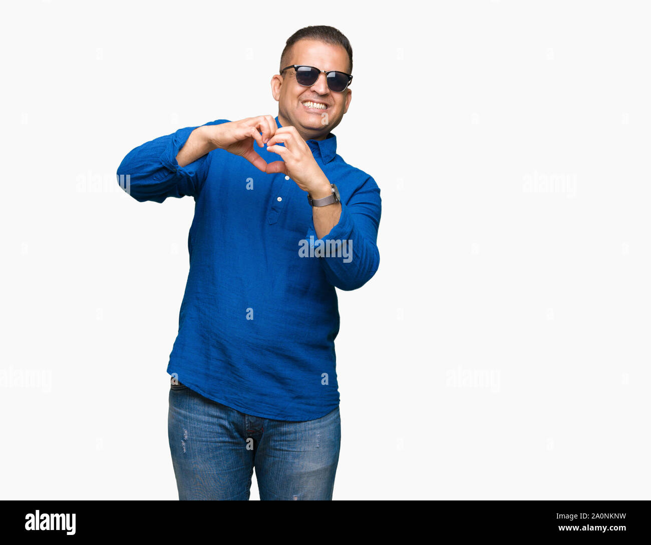 Middle age arab man wearing sunglasses over isolated background smiling ...