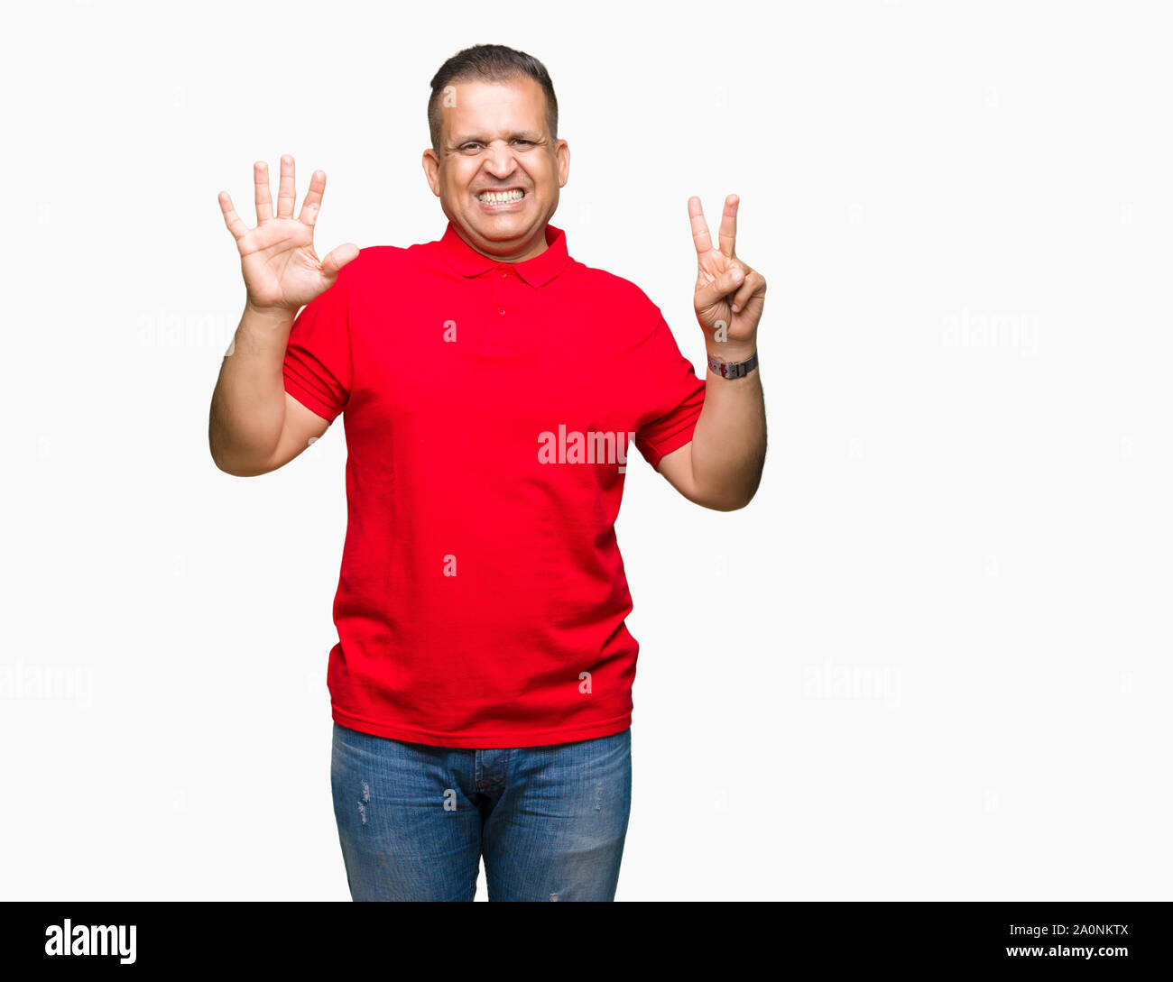 Middle age arab man over isolated background showing and pointing up ...