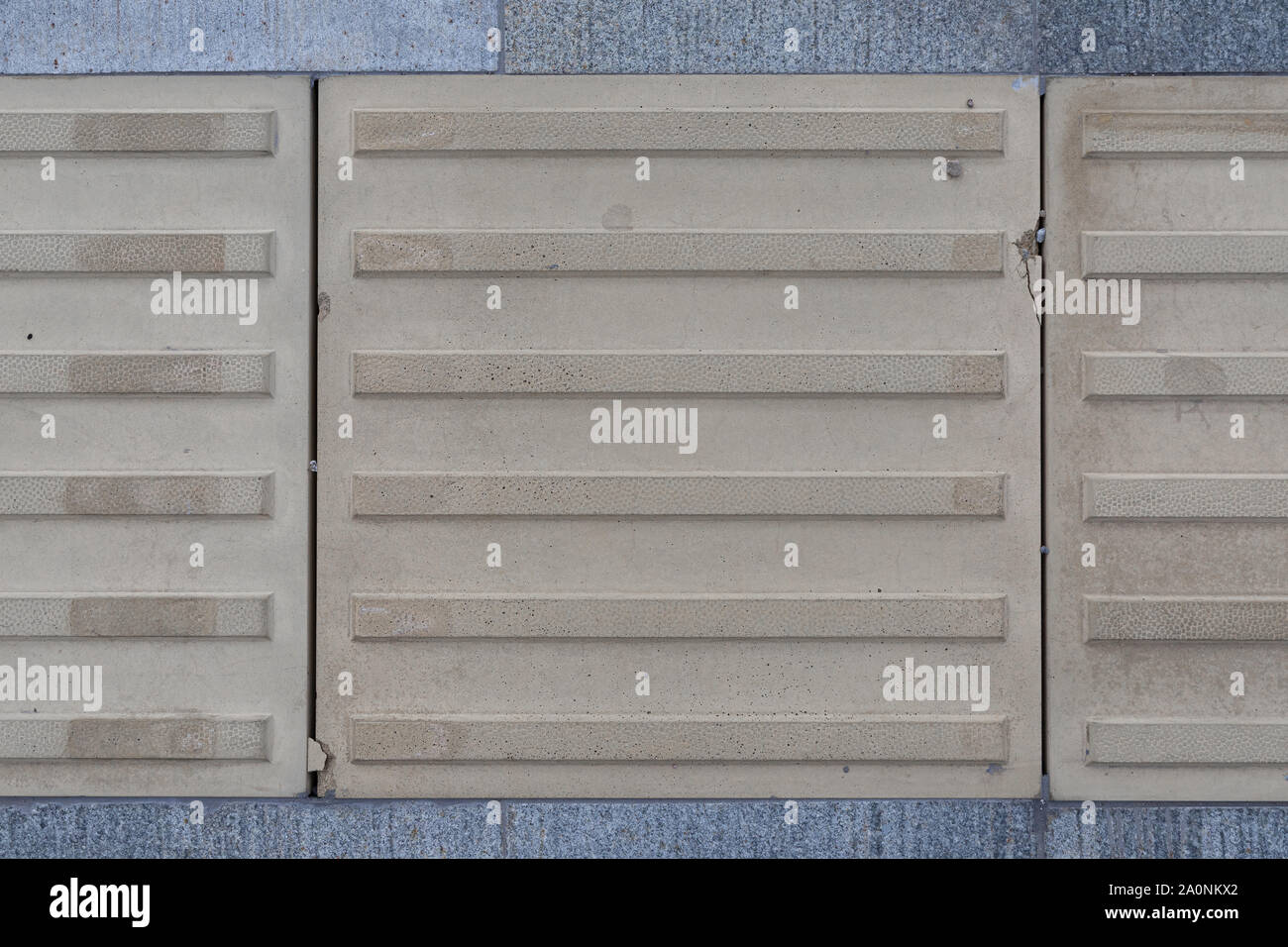 Walkway with grey tactile paving for blind people Stock Photo - Alamy