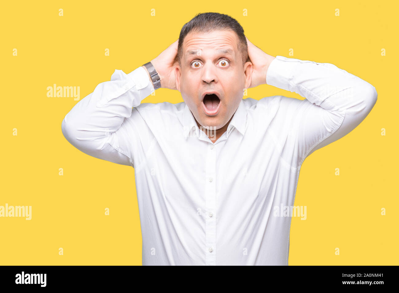 Middle age arab elegant man over isolated background Crazy and scared ...