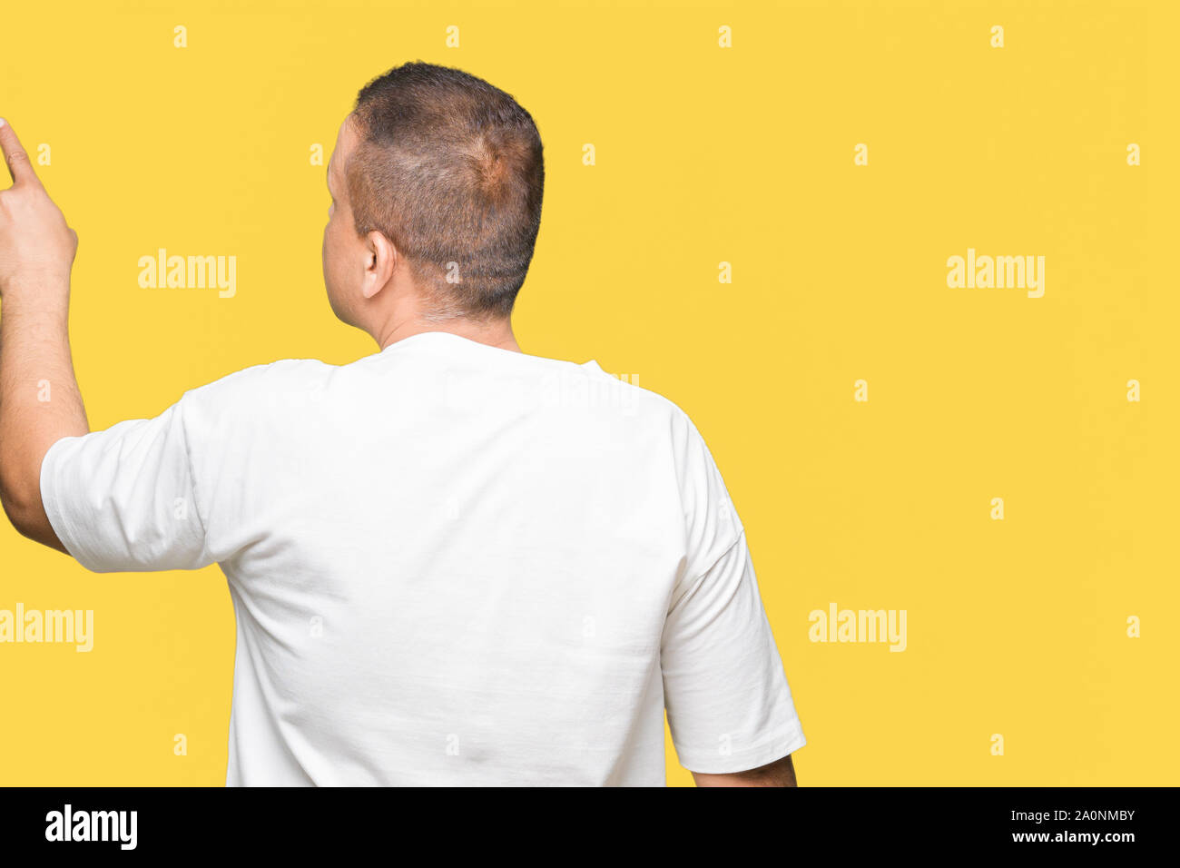 Middle age arab man wearig white t-shirt over isolated background ...