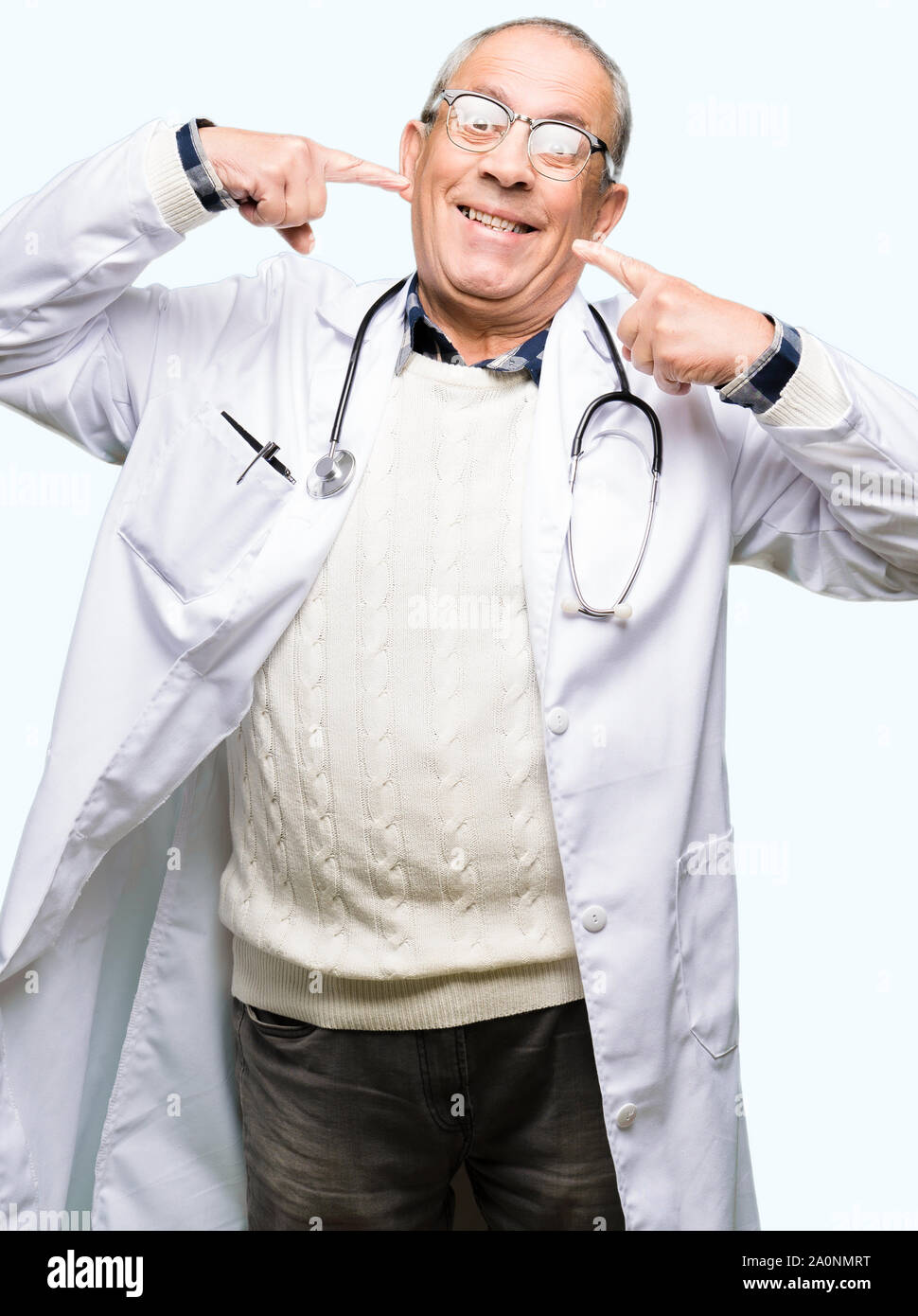 Handsome senior doctor man wearing medical coat smiling confident ...