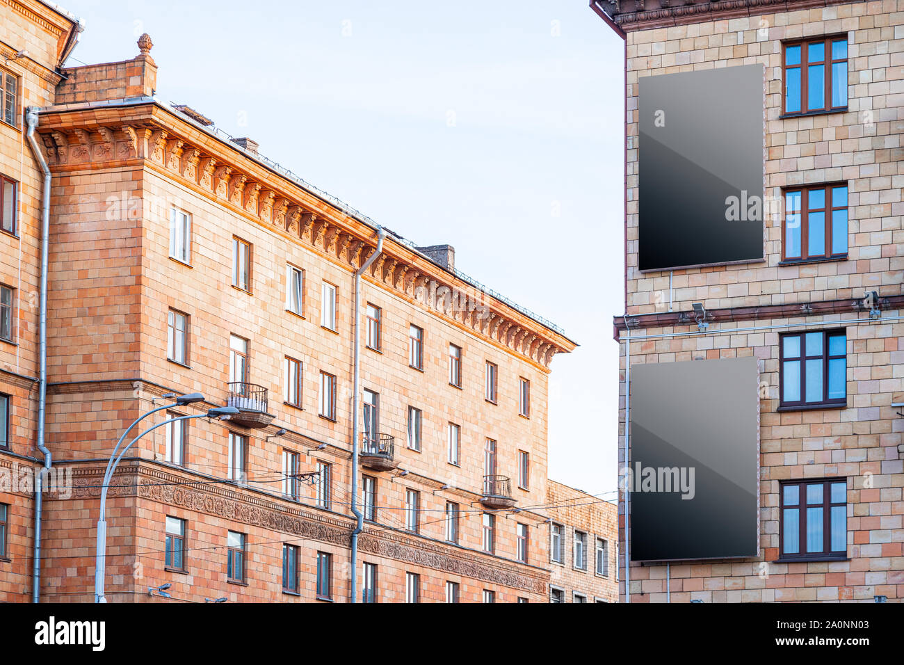Advertisement boards on building in city centre Stock Photo - Alamy