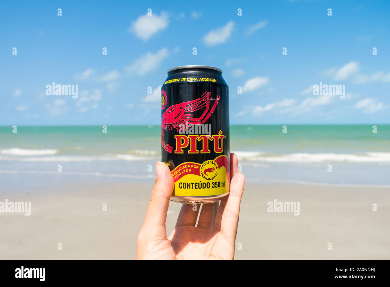 Ilha de Itamaraca, Brazil - Circa August 2019: Hand holding a Pitu can ...