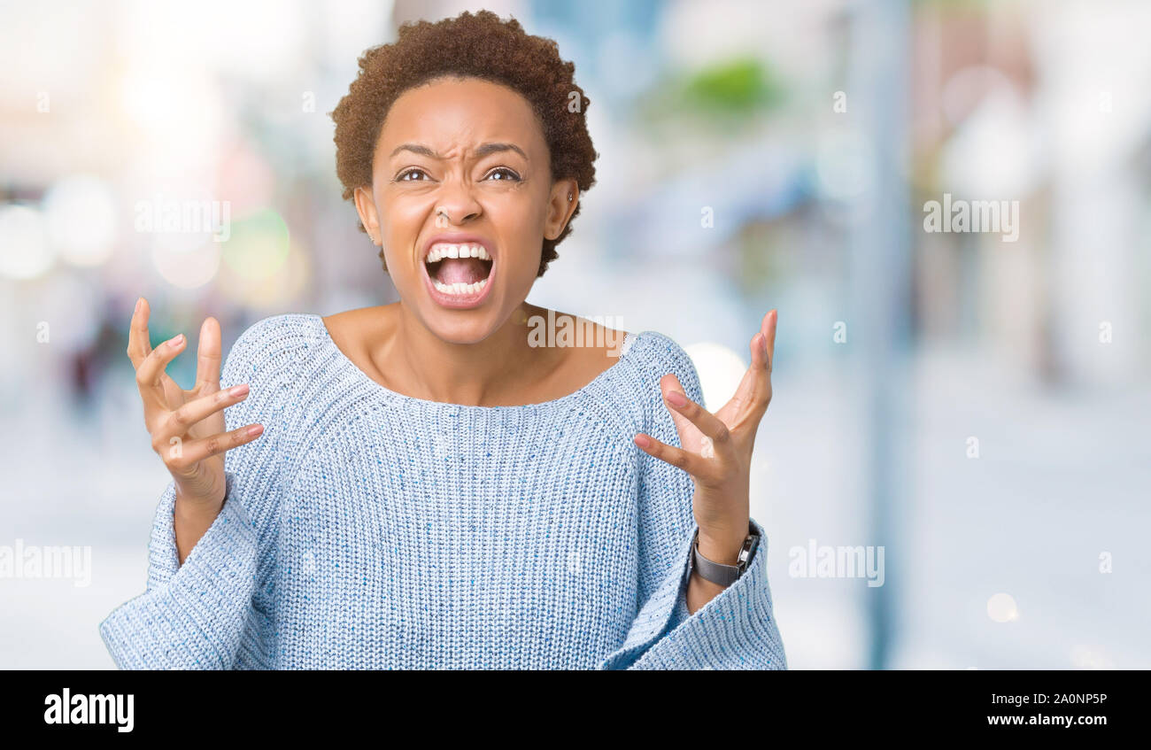 Young beautiful african american woman wearing a sweater over isolated ...