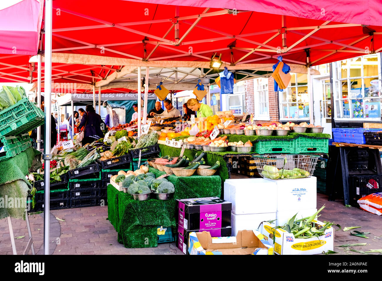 Market Trader Selling Fresh Fruit and Vegetables, Including Broccoli ...