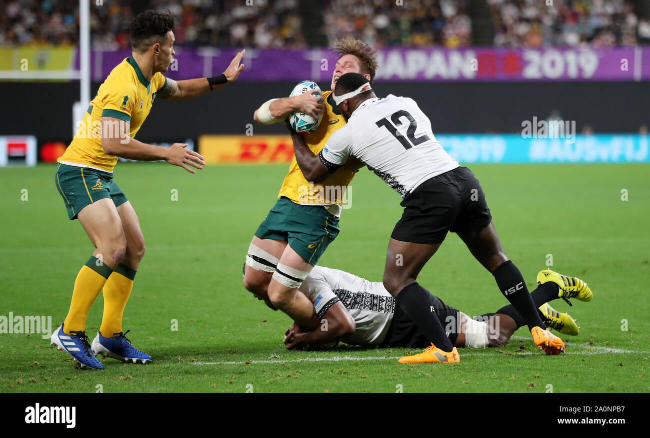 Fiji's Levani Botia tackles Australia's Michael Hooper high and is ...
